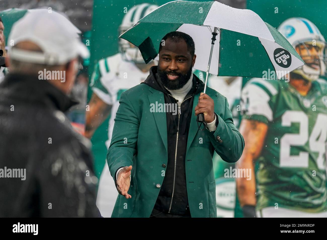 Former New York Jets player Derrelle Revis is honored on the field ...