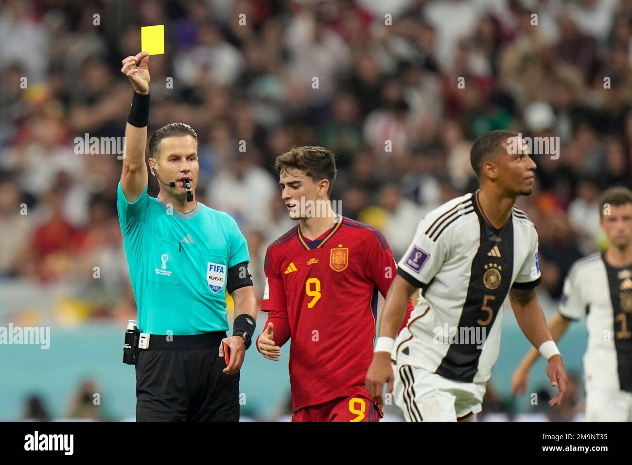 Germany's Thilo Kehrer, right, receives a yellow card during the World ...