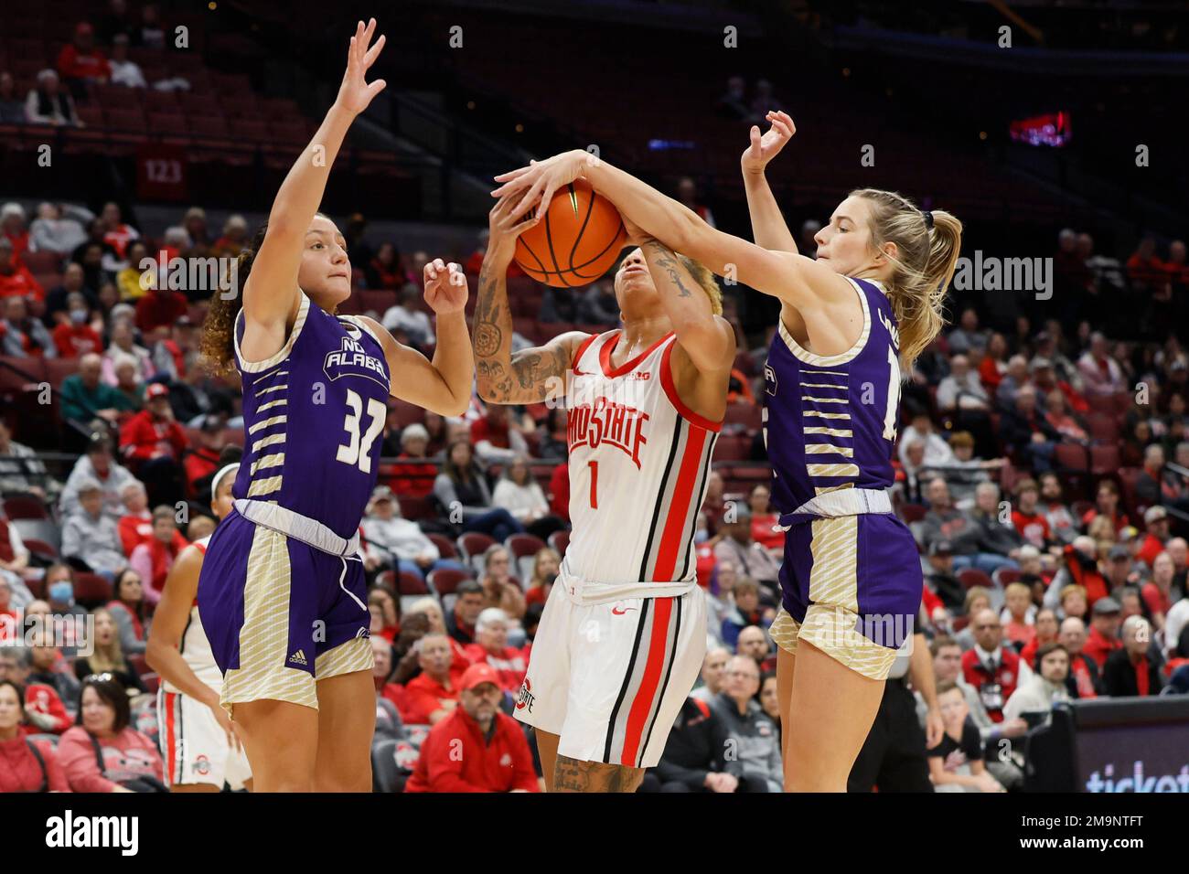 Ohio State's Rikki Harris, center, tries to shoot between North Alabama ...