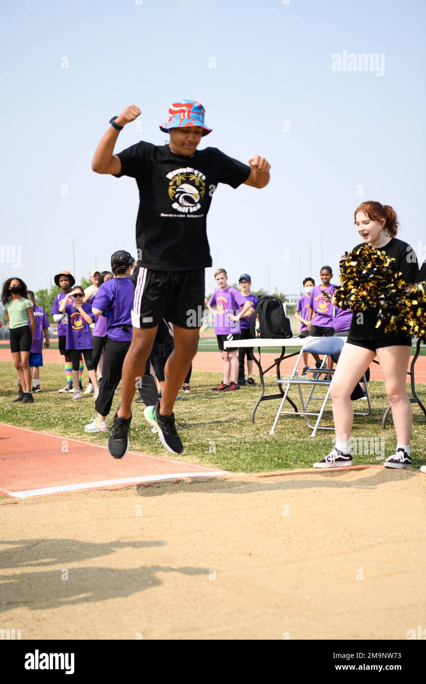 A Humphreys High School student participates in the long jump event at ...