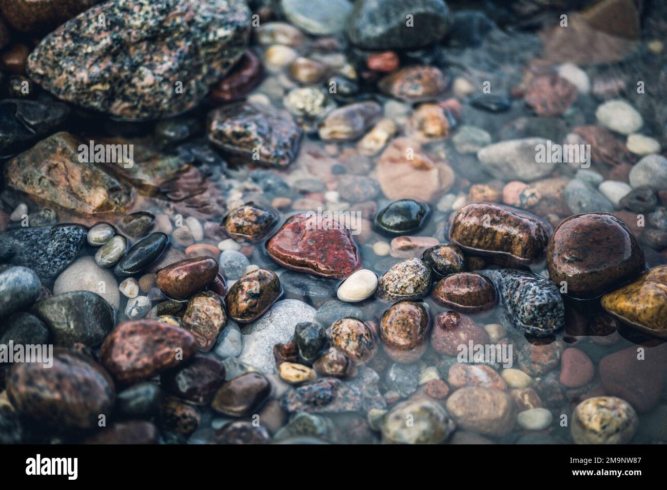 Smooth sea stones. Sea shore. Background Stock Photo - Alamy