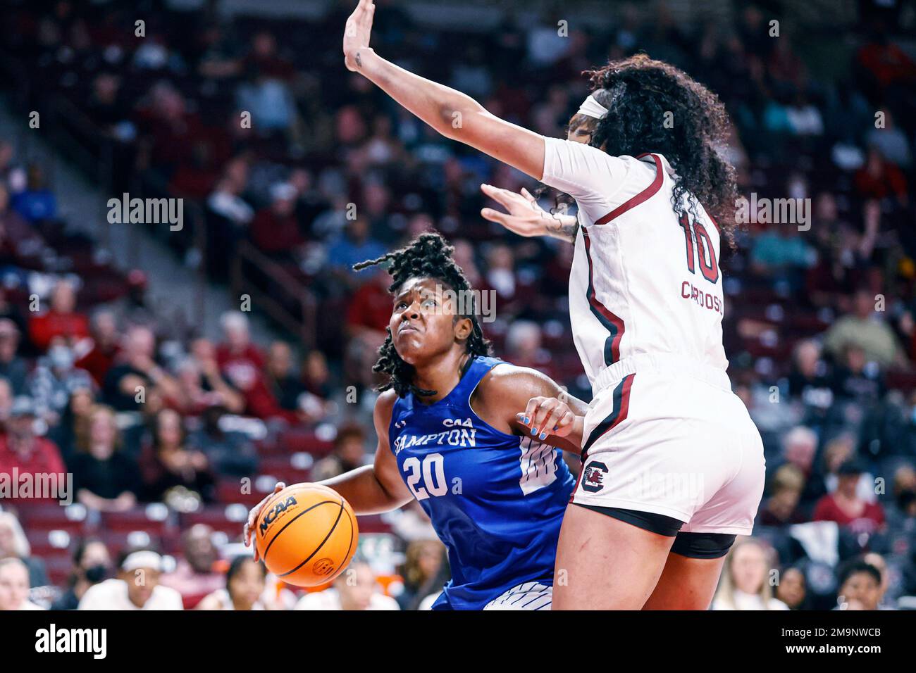 Hampton forward Nylah Young, left, drives to the basket against South ...