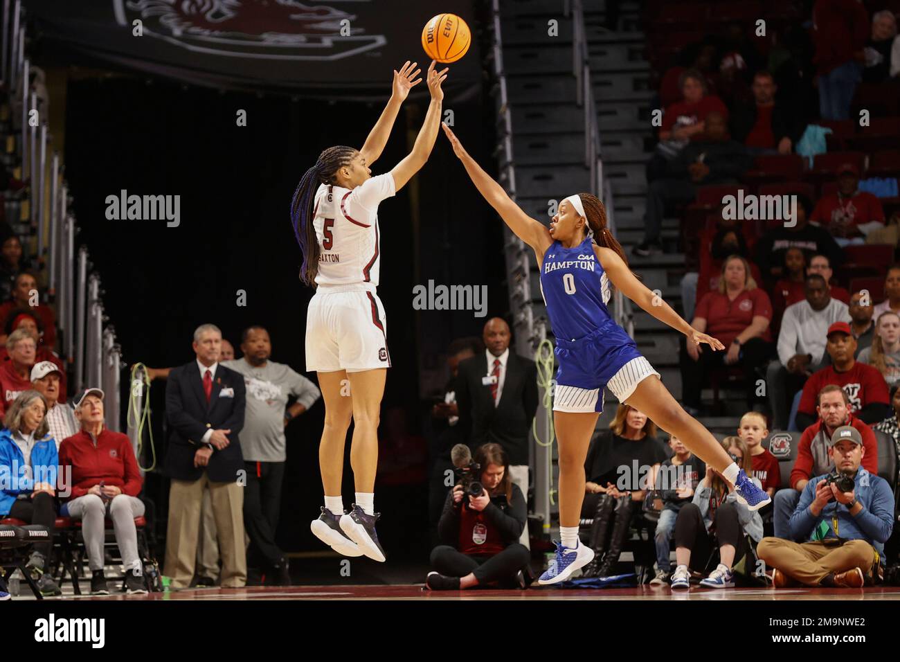 South Carolina forward Victaria Saxton, left, shoots over Hampton guard ...
