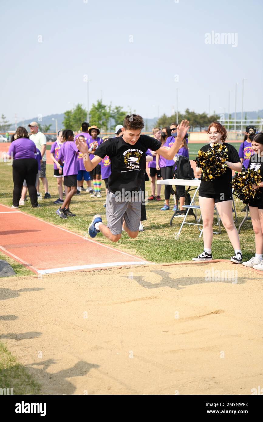 A Humphreys High School student participates in the long jump event at ...
