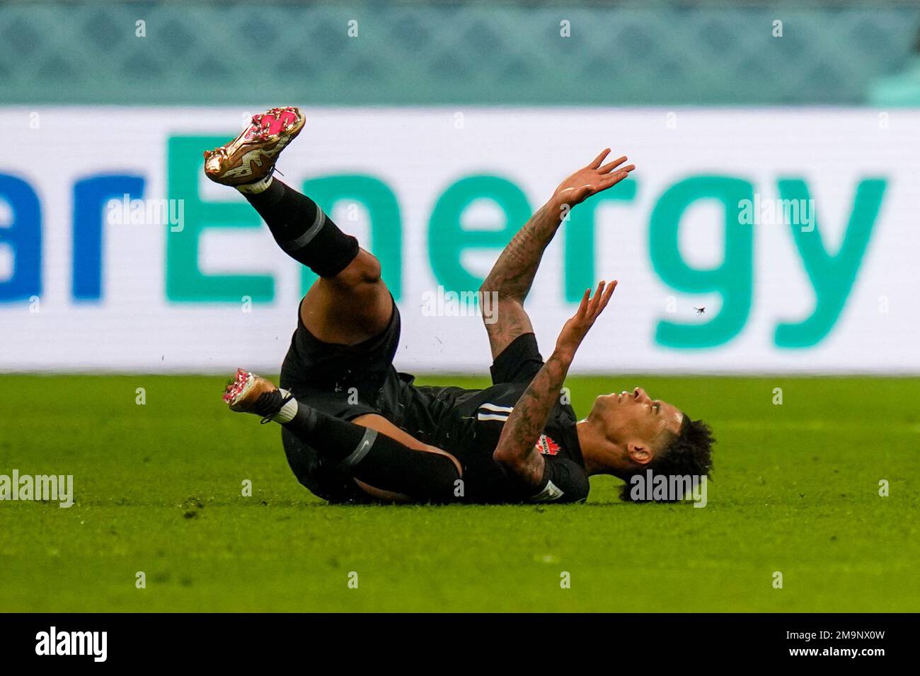 Canada's Tajon Buchanan falls during the World Cup group F soccer match ...