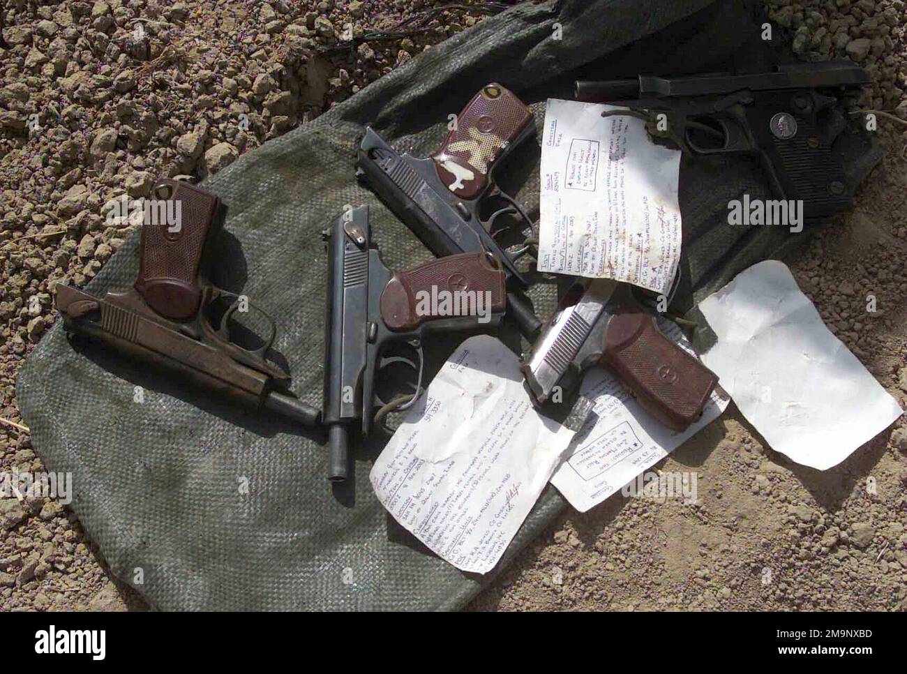 Captured Iraqi 9mm SR-1 Makarvo pistols are displayed after US Marine ...