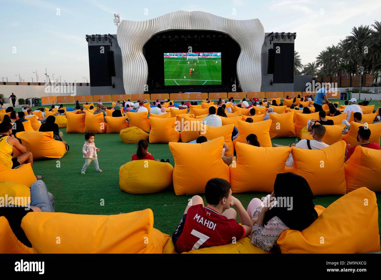 Soccer fans watch a match on the screen during the World Cup group F ...