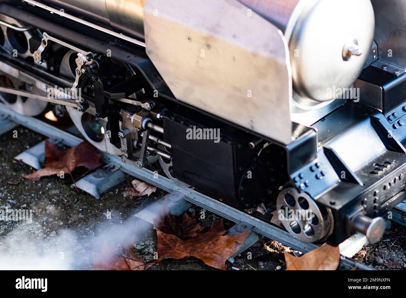 Iron steam train close up still on a railway from high up point of view ...