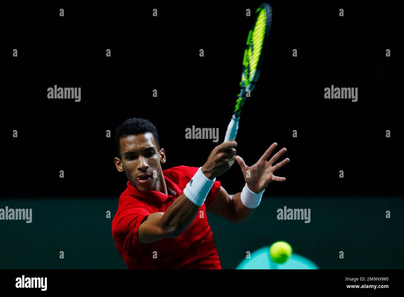 Canada's Felix Auger Aliassime returns the ball to Australia's Alex de Minaur during the final ...