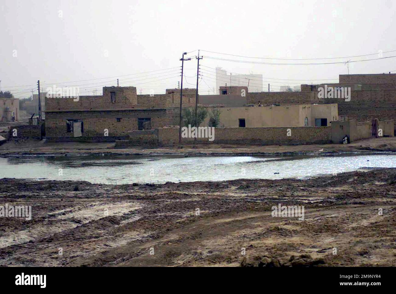 Wide-angle view showing water collecting in an open field, blocking ...