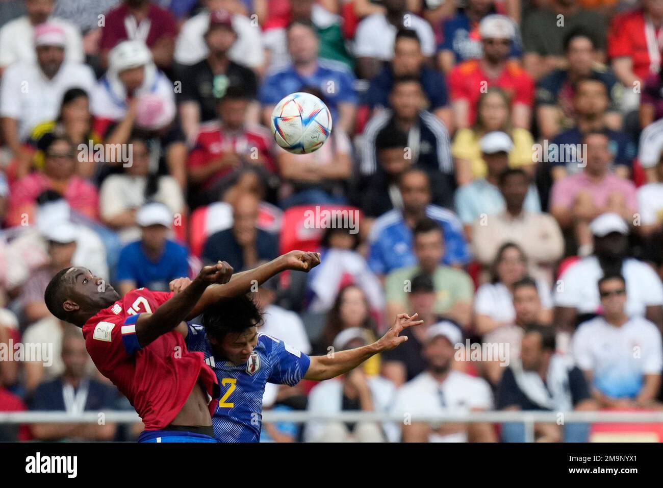 Costa Rica's Joel Campbell, left, and Japan's Miki Yamane challenge for the ball during the ...
