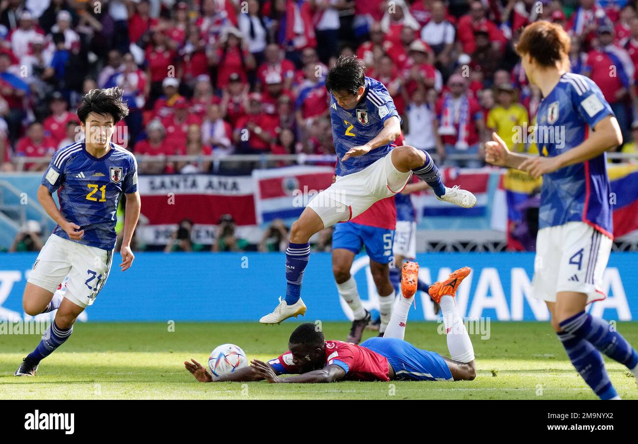 Japan's Miki Yamane, up, and Costa Rica's Joel Campbell, on the ground, challenge for the ball ...