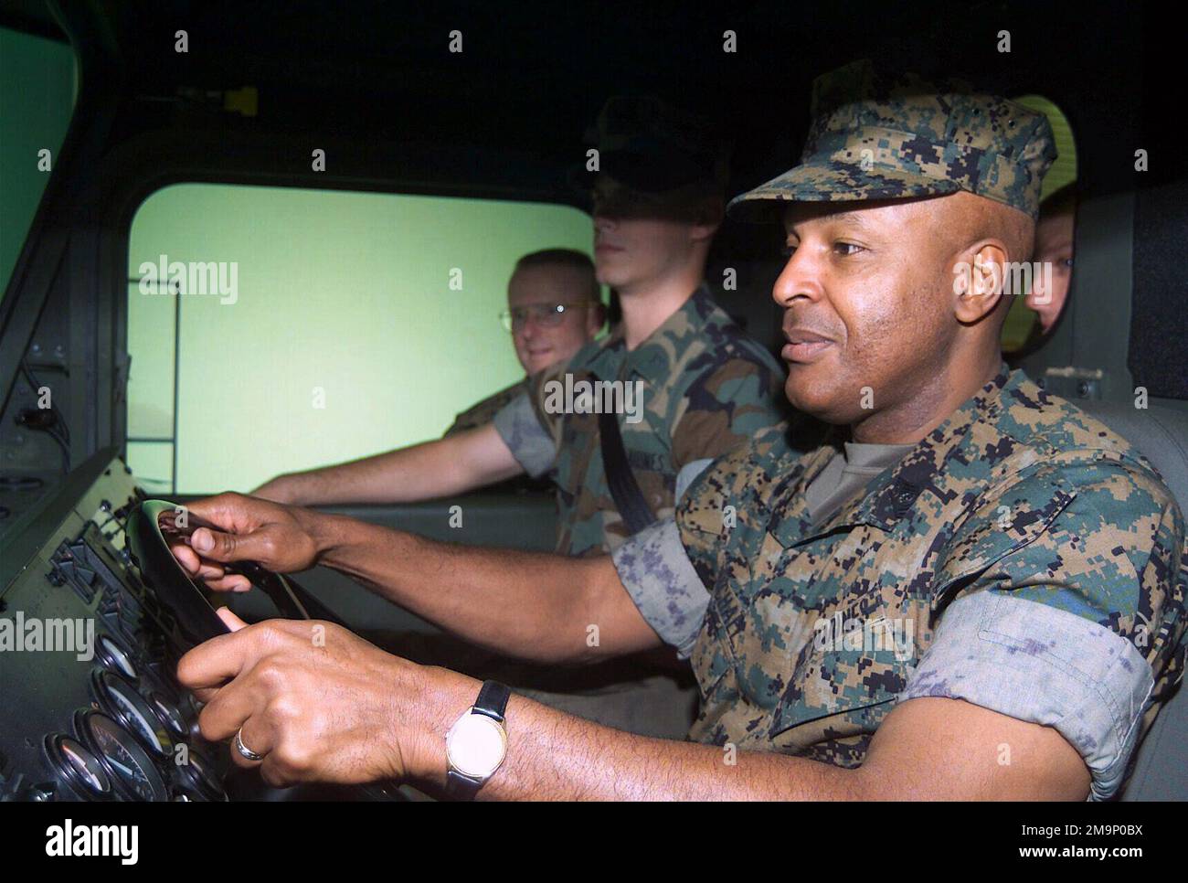 Sergeant Major of the Marine Corps Alford McMichael, (center), embarks ...