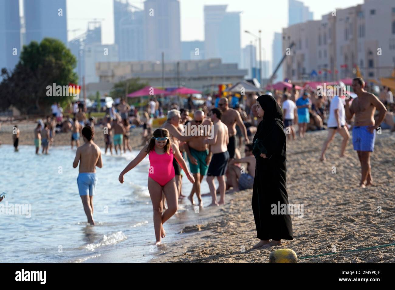 Beachgoers enjoy the day in Doha, Qatar, Thursday, Nov. 24, 2022. (AP ...
