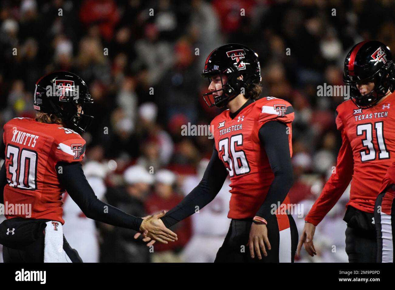 Texas Tech place-kicker Trey Wolff (36) and long snapper Jackson Knotts ...