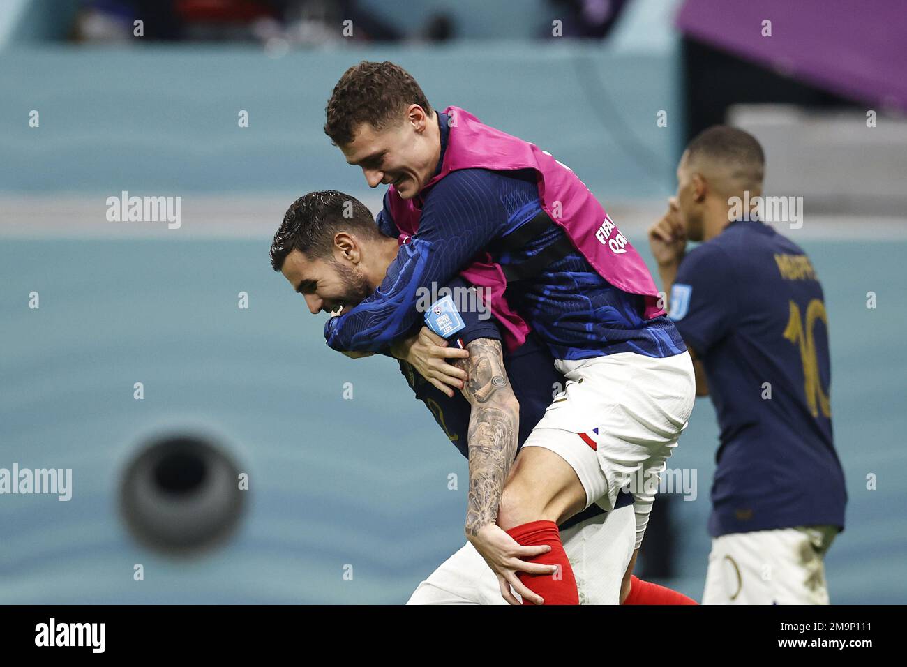 AL KHOR - Randal Kolo Muani of France and Benjamin Pavard of France ...