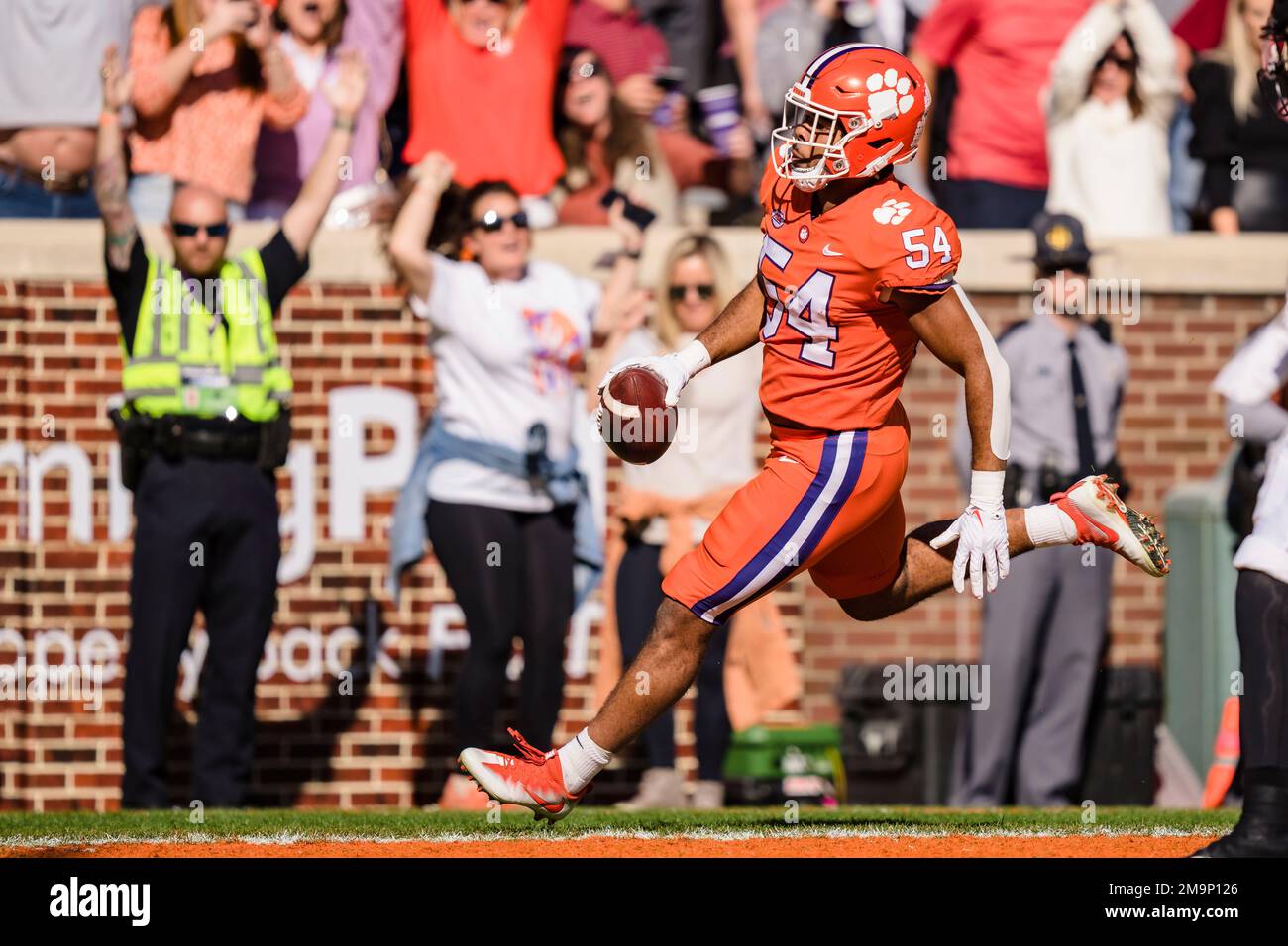 Clemson linebacker Jeremiah Trotter Jr. (54) scores on an interception ...