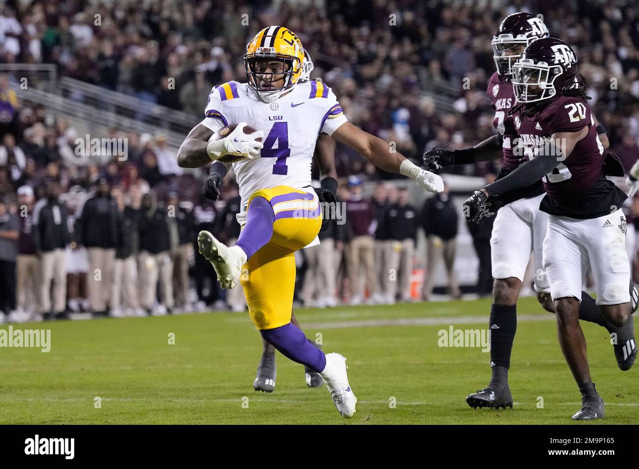 LSU running back John Emery Jr. (4) high-kicks into the end zone for a ...