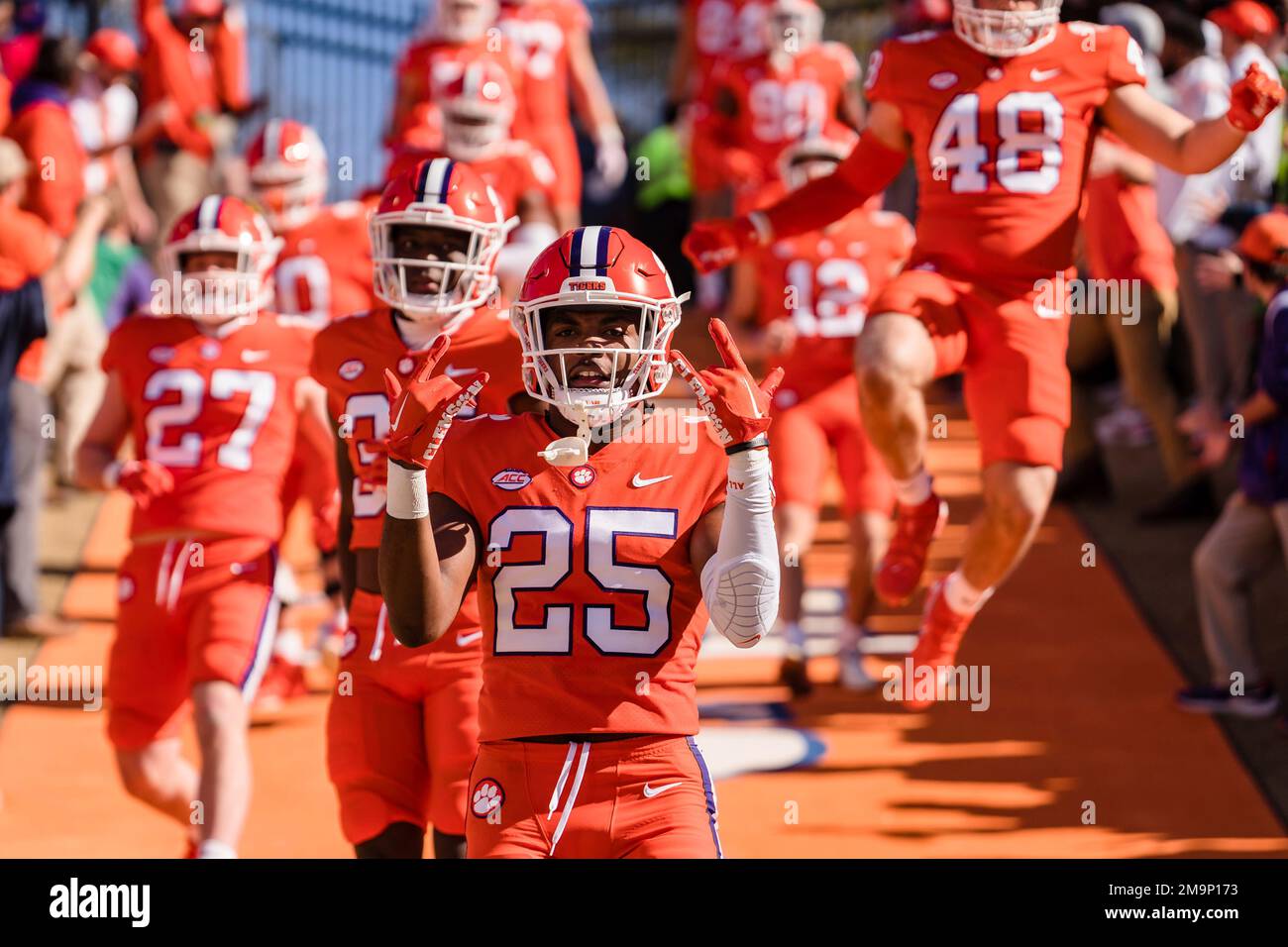 Clemson safety Jalyn Phillips (25) runs down the hill before the start ...
