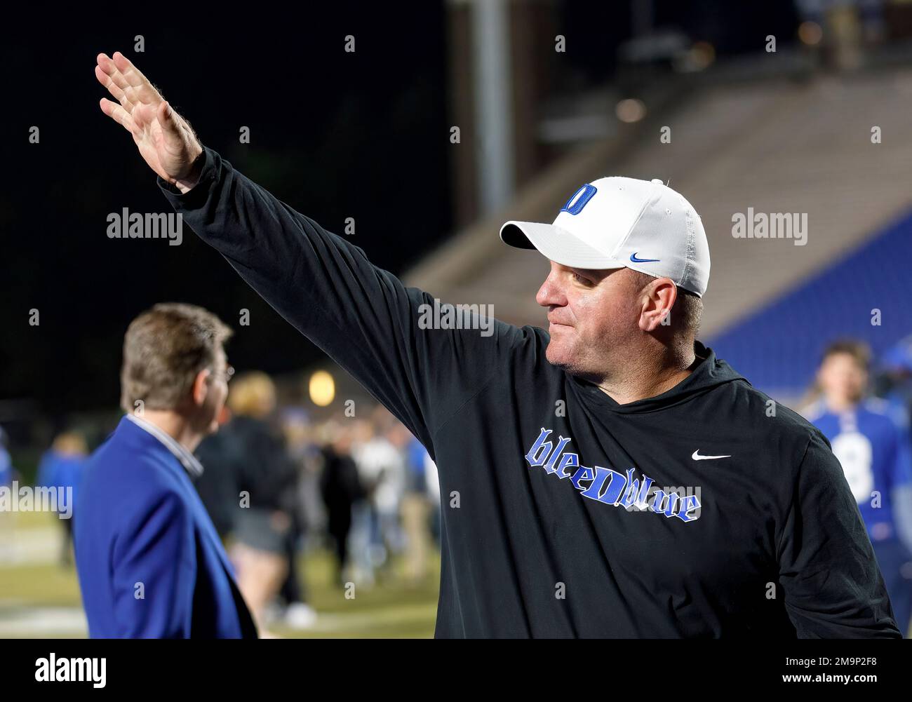 Duke head coach Mike Elko waves to fans as he walks off the field after ...