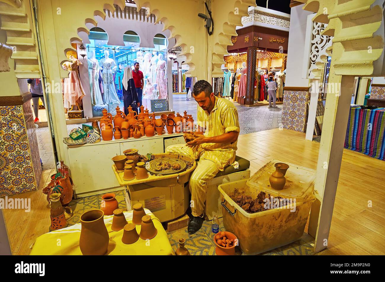 DUBAI, UAE - MARCH 6, 2020: The potter works at the potter's wheel ...