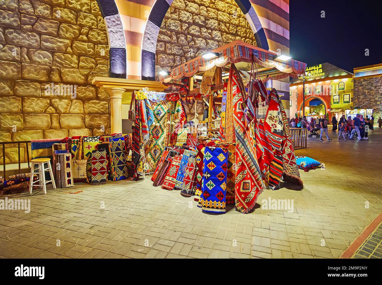 The small rug stall in Global Village Dubai with colored traditional ...
