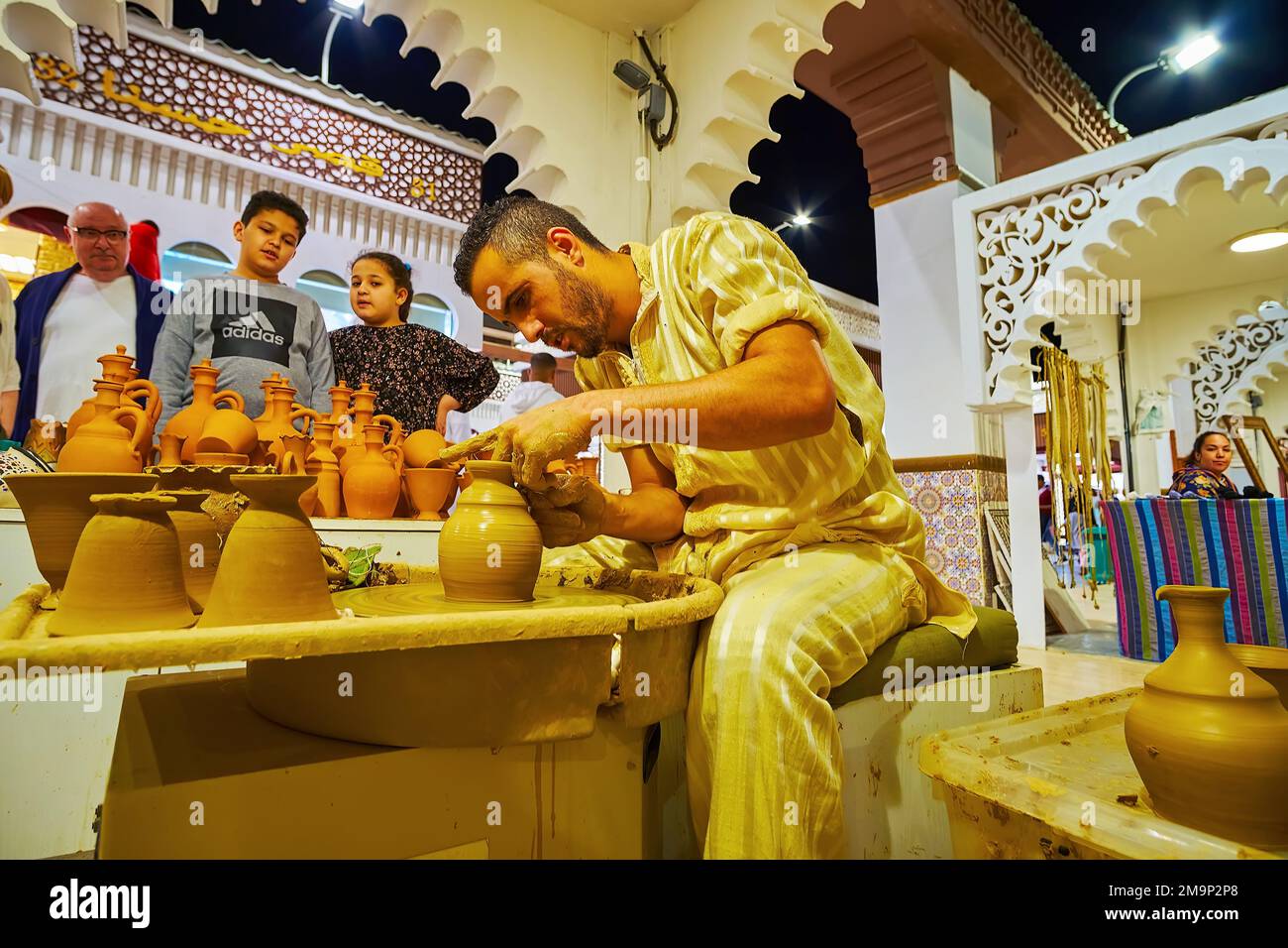 DUBAI, UAE - MARCH 6, 2020: The potter makes the clay pot at potter's ...