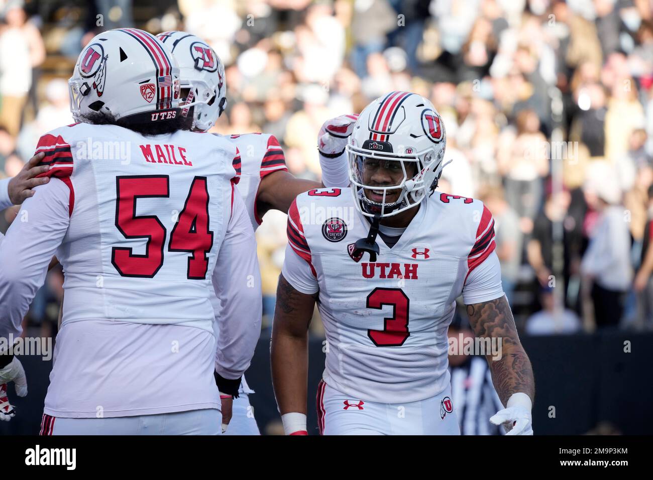 Utah quarterback Ja'Quinden Jackson, right, is congratulated by ...