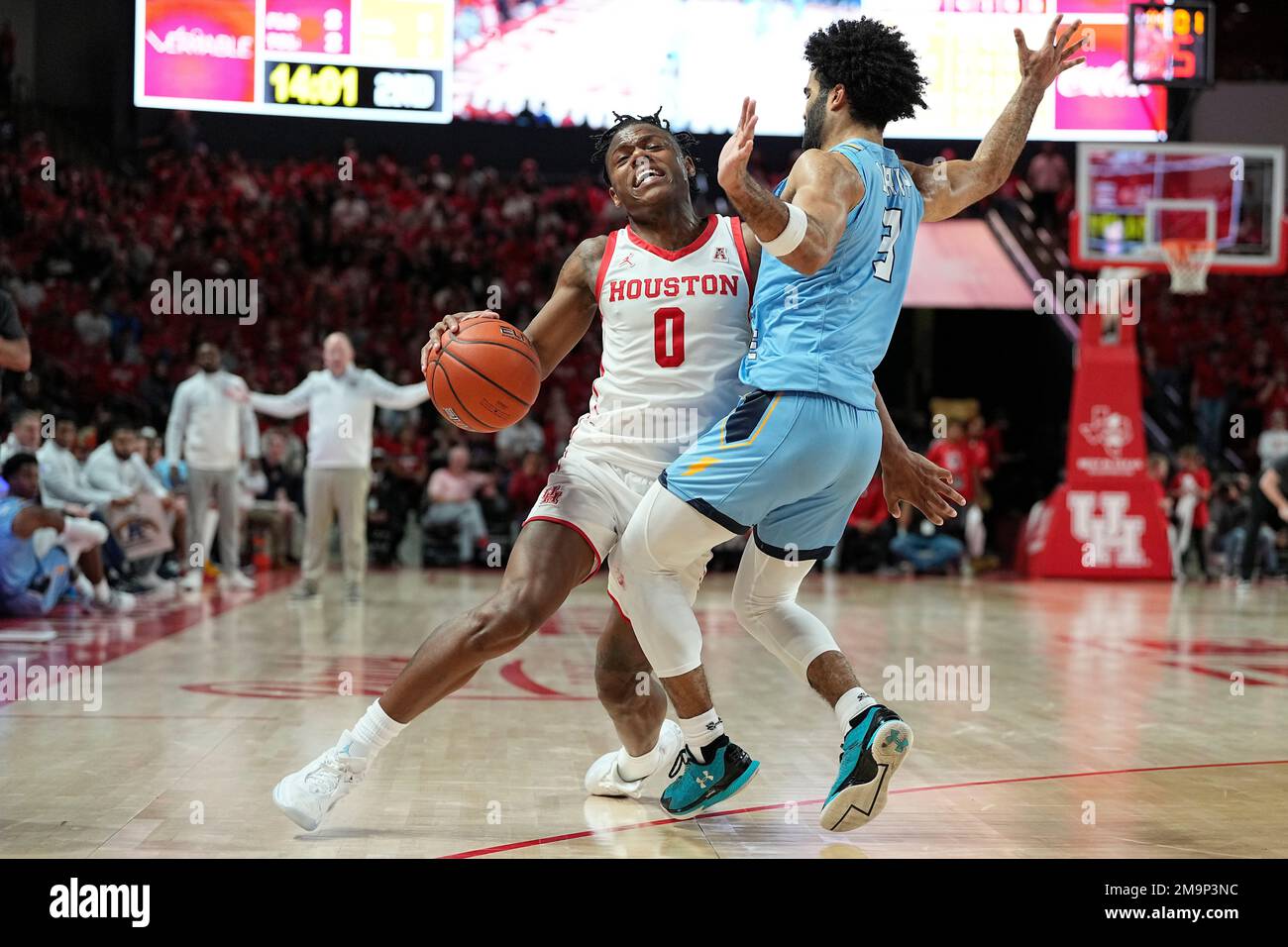 Houston guard Marcus Sasser (0) is defended by Kent State guard Sincere ...