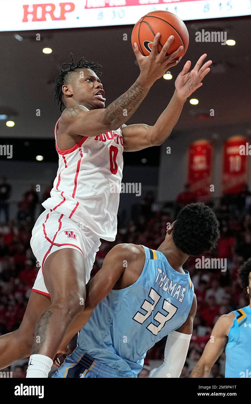 Houston guard Marcus Sasser (0) is called for a charge on Kent State ...