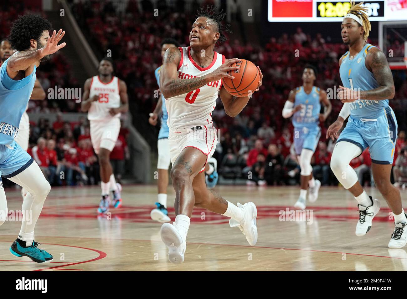 Houston guard Marcus Sasser (0) drives to the basket during the first ...