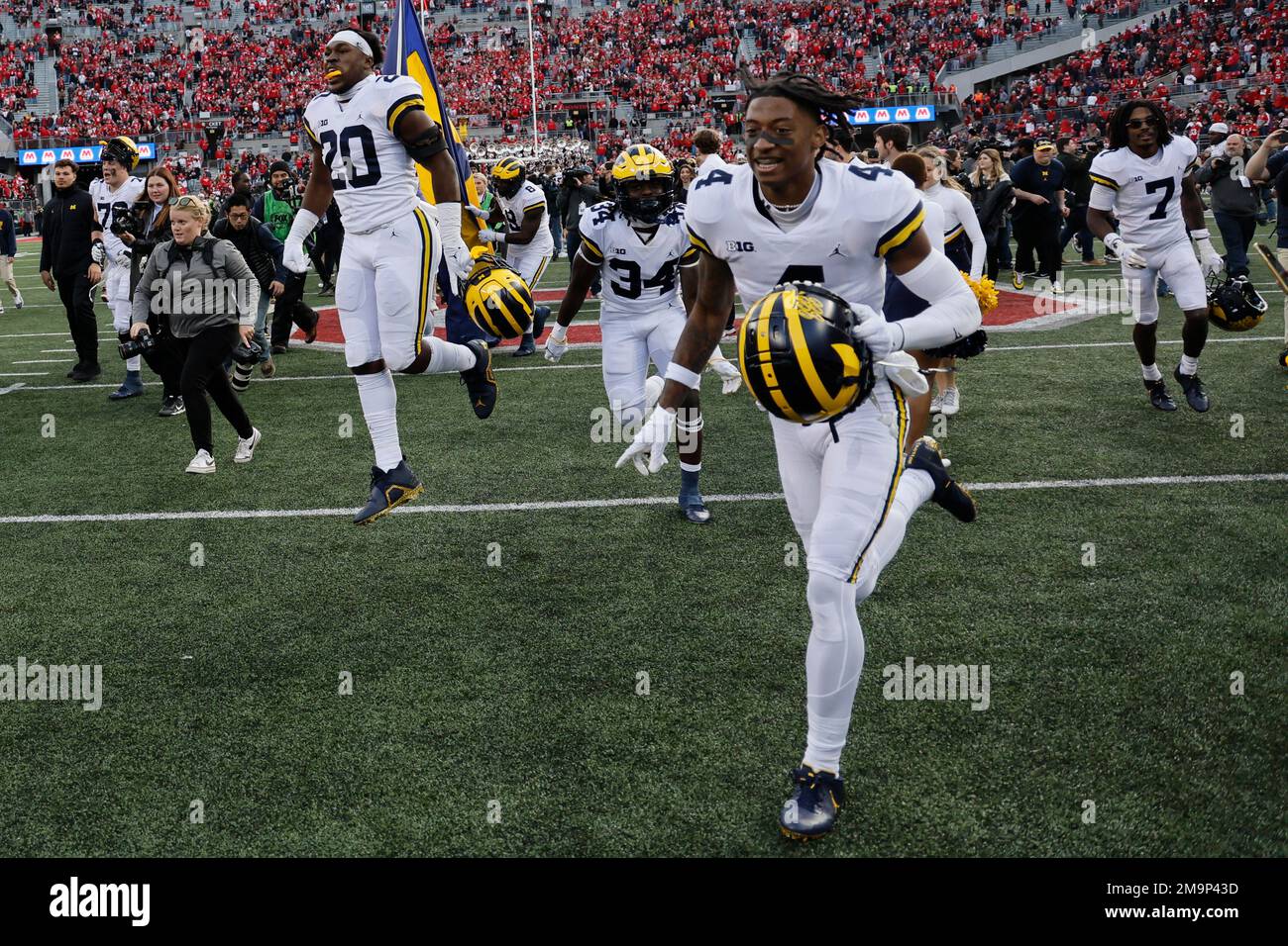 Michigan players celebrate their win over Ohio State after an NCAA ...