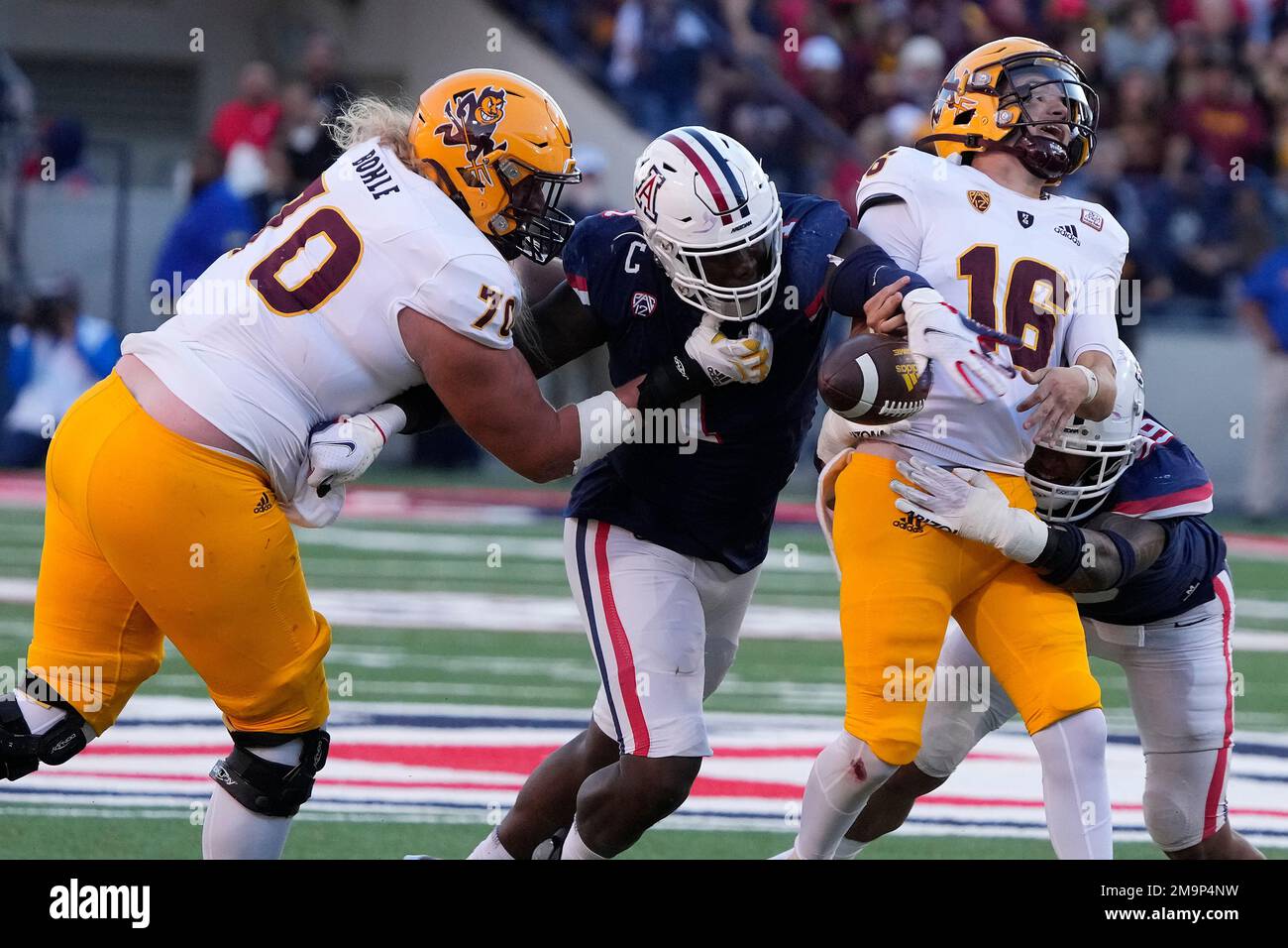 Arizona defensive lineman Jalen Harris (1) and defensive lineman ...
