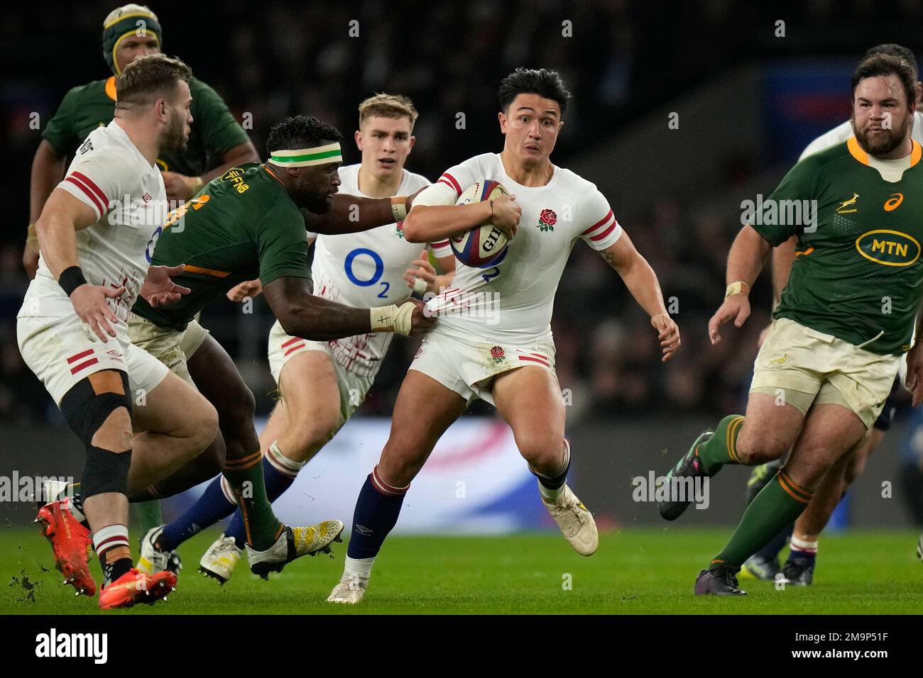 England's Marcus Smith is tackled by South Africa's Siya Kolisi during ...