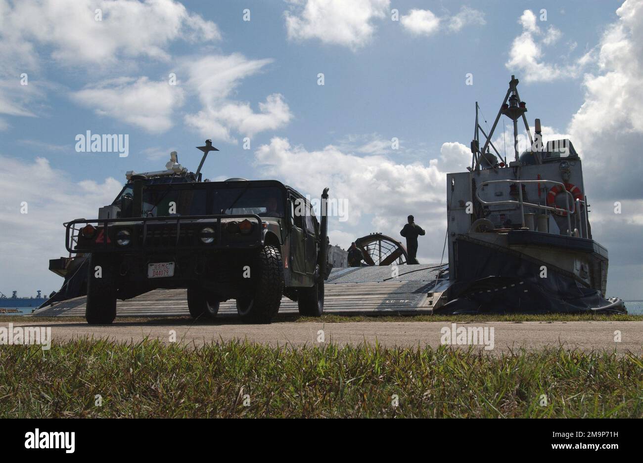 Deployed from a US Navy (USN) Landing Craft, Air Cushioned (LCAC), a US ...