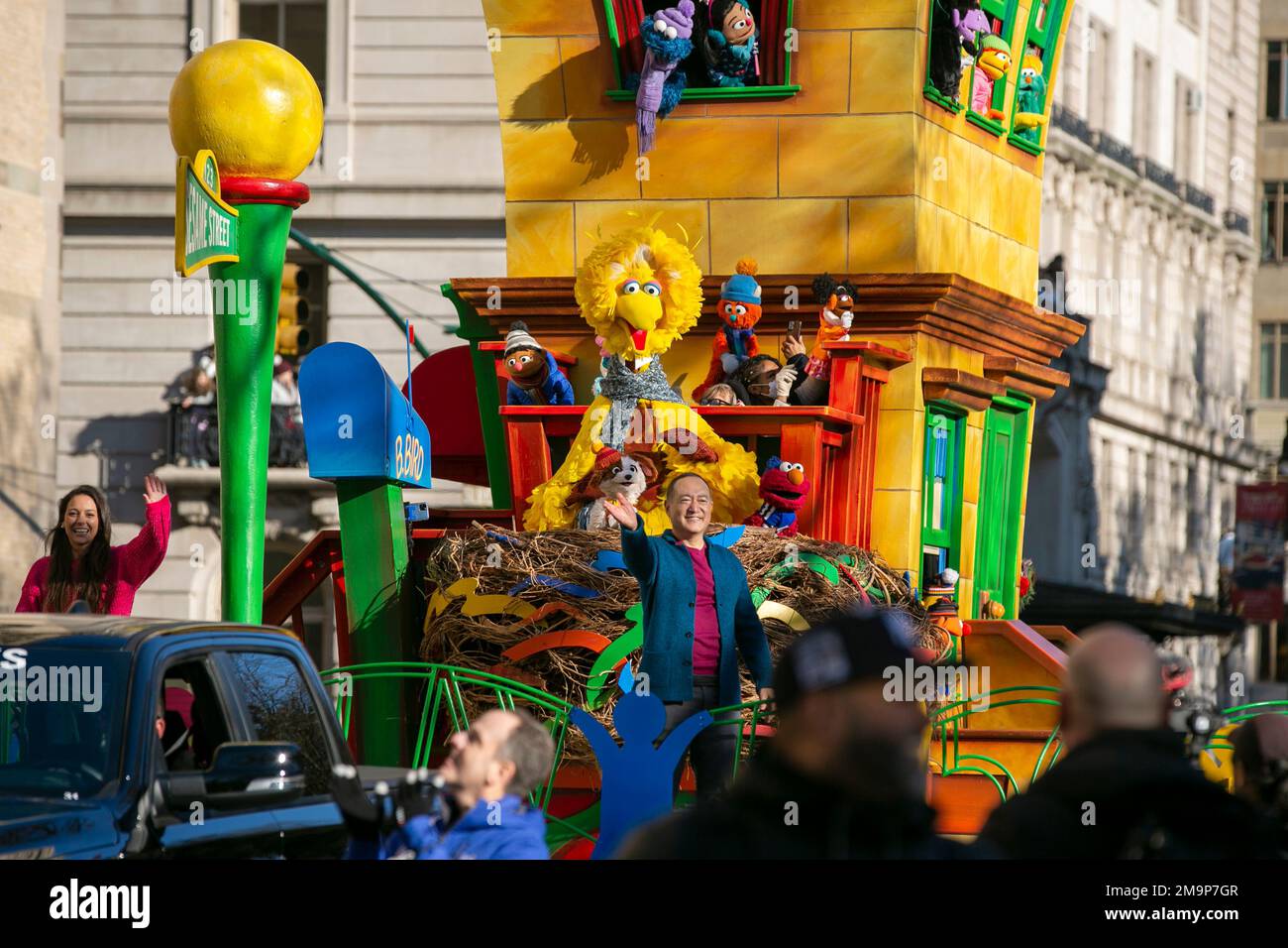 Sesame Street cast, including Alan Muraoka and Muppets, are on a float ...