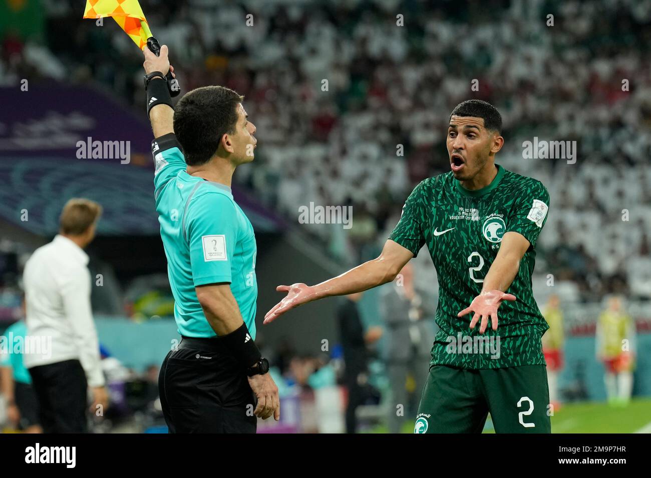 Saudi Arabia's Sultan Al-Ghanam, right, argues with linesman during the ...