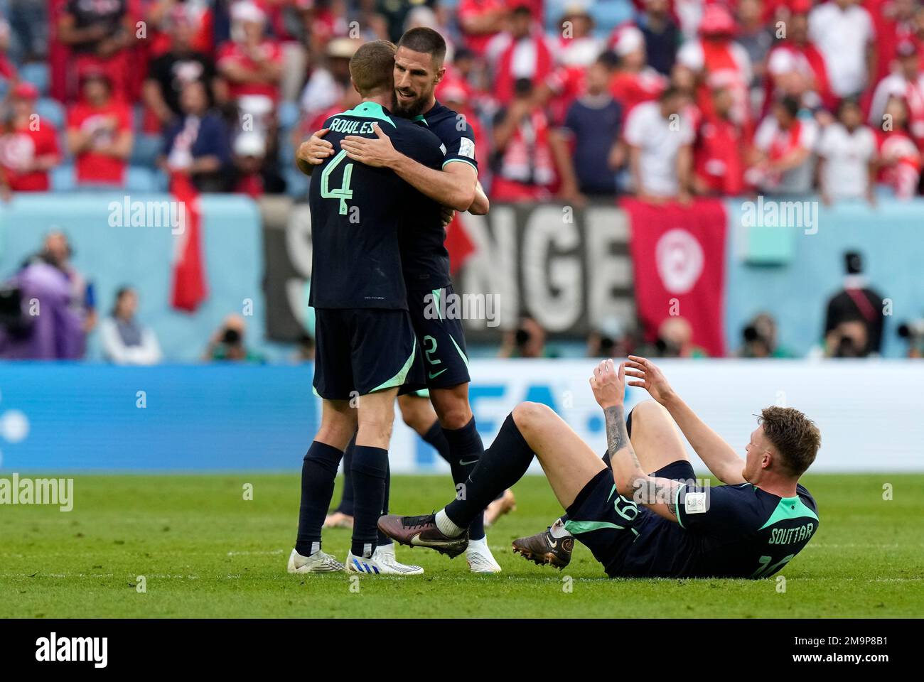 Australia's Kye Rowles embraces Australia's Milos Degenek after winning ...