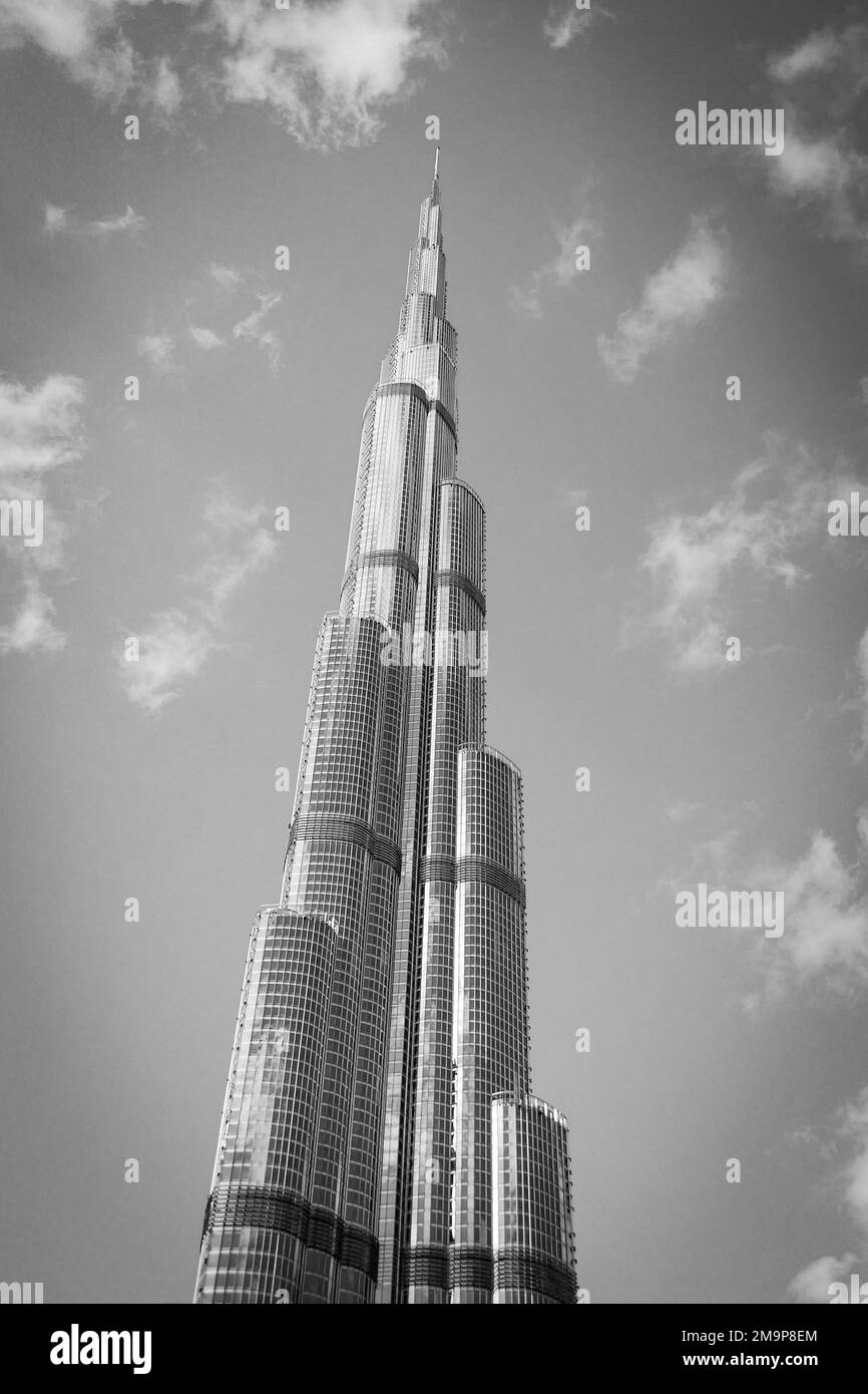 A vertical grayscale shot of the Burj Khalifa building against the sky ...
