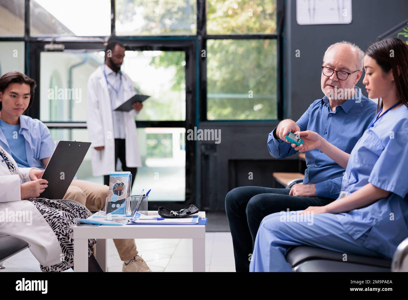 Assistant Doing Diabetes Rutine Control For Senior Patient Using Glucometer During Consultation