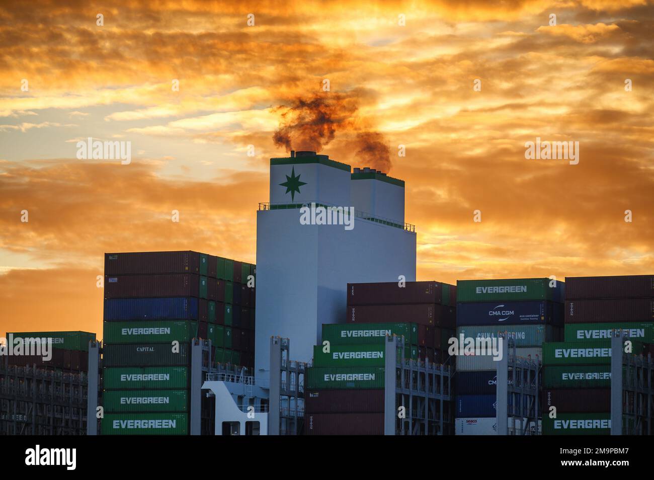 Sunset view of the funnel and cargo of the Evergeen container ship Ever ...