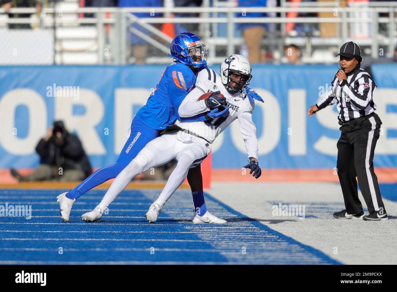 Utah State wide receiver Justin McGriff (10) is pushed out of bounds by ...