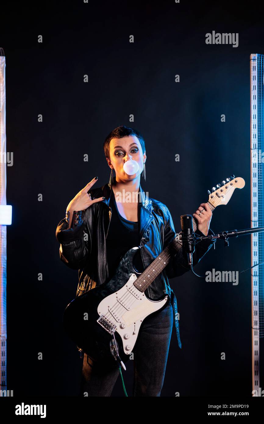 Female guitarist playing hard rock hi-res stock photography and images ...