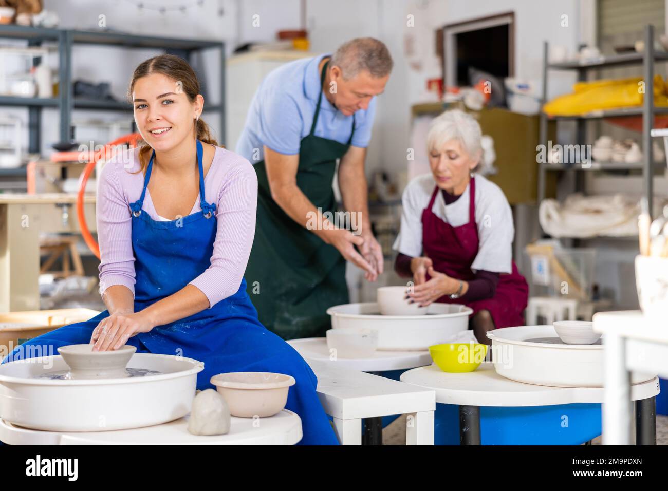 girl works with potter wheel Stock Photo - Alamy