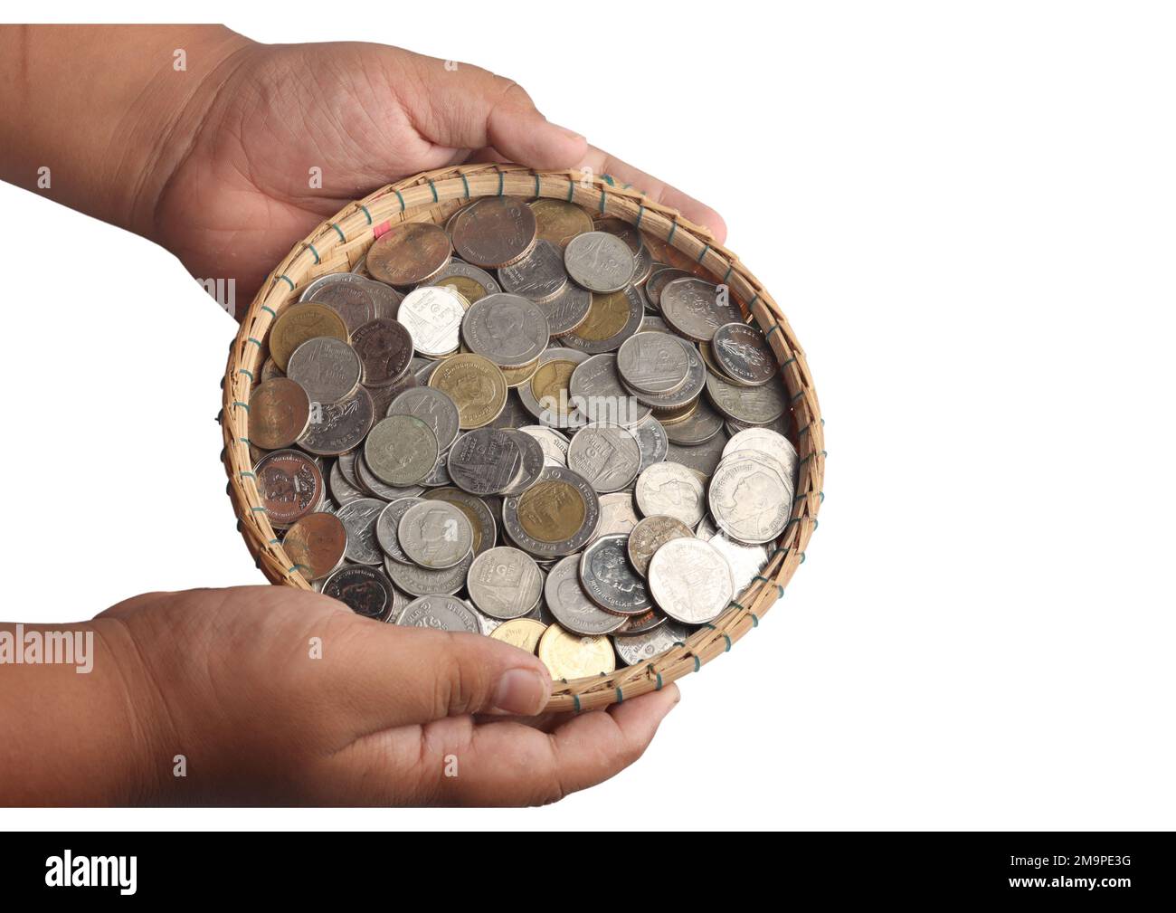 Coins in a bamboo basket on a white background.Saving money concept ...