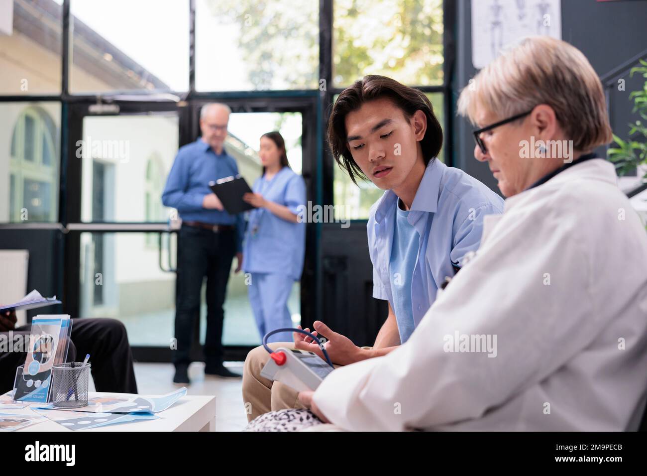 Specialist doctor measuring patient hypertension and blood pressure to ...