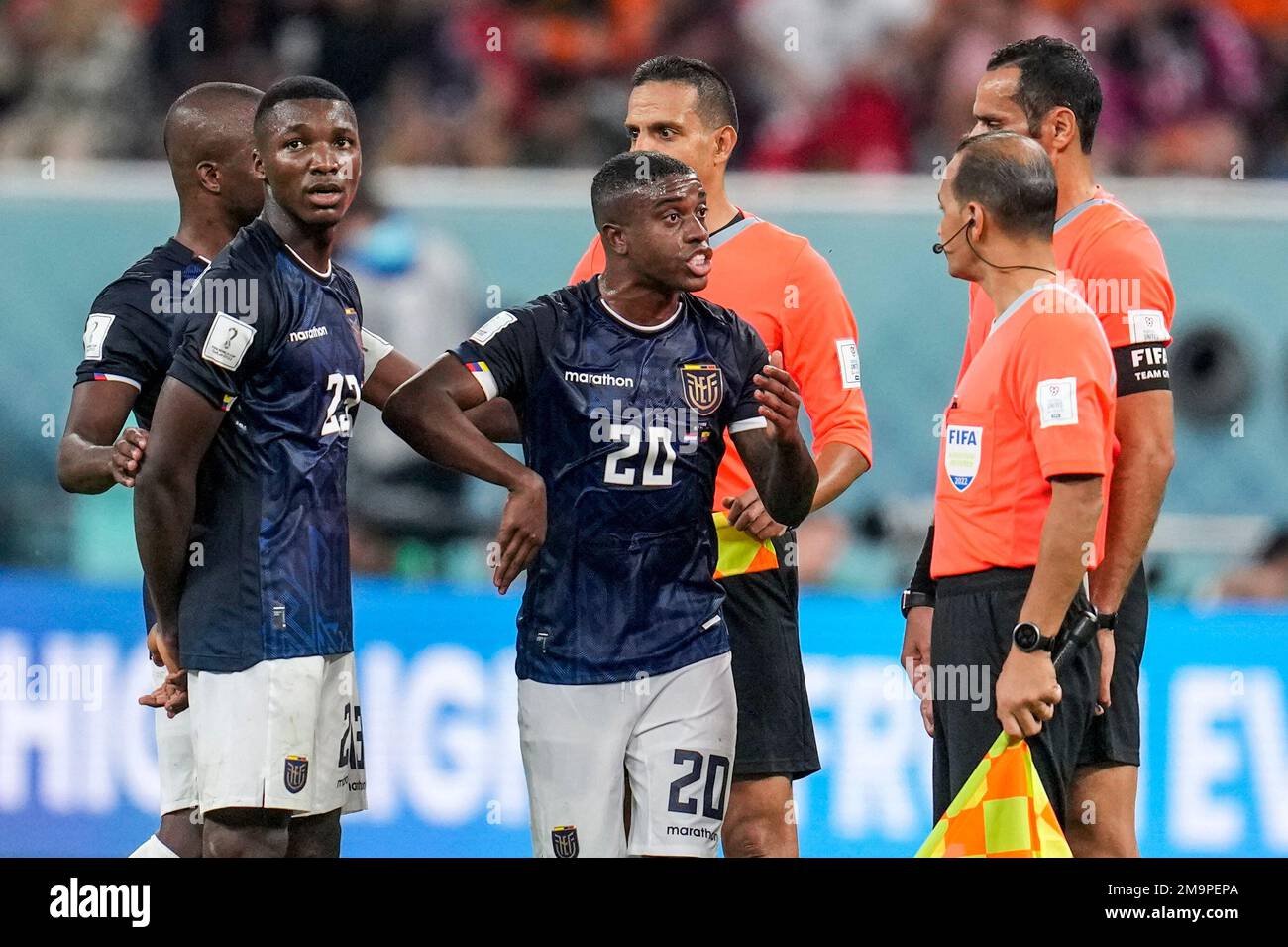 Ecuador's Jhegson Mendez, center, talks with the referee Mustapha ...