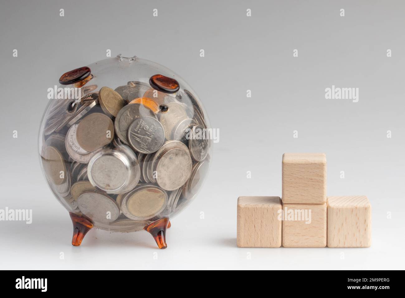 Transparent piggy bank with a wooden block for inserting messages Stock ...