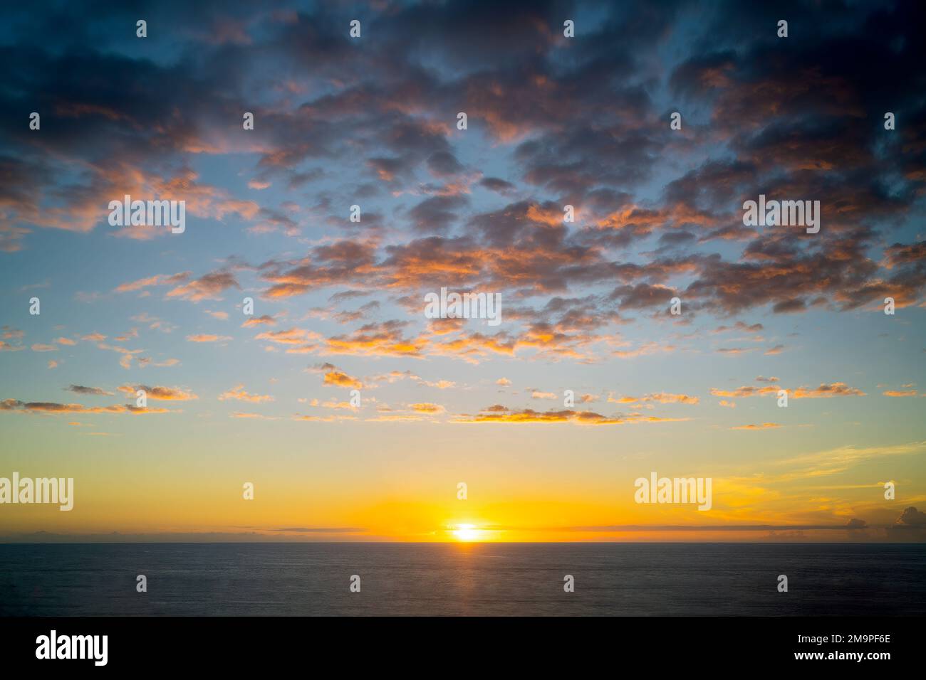 Sunset clouds over Hawaii Stock Photo - Alamy