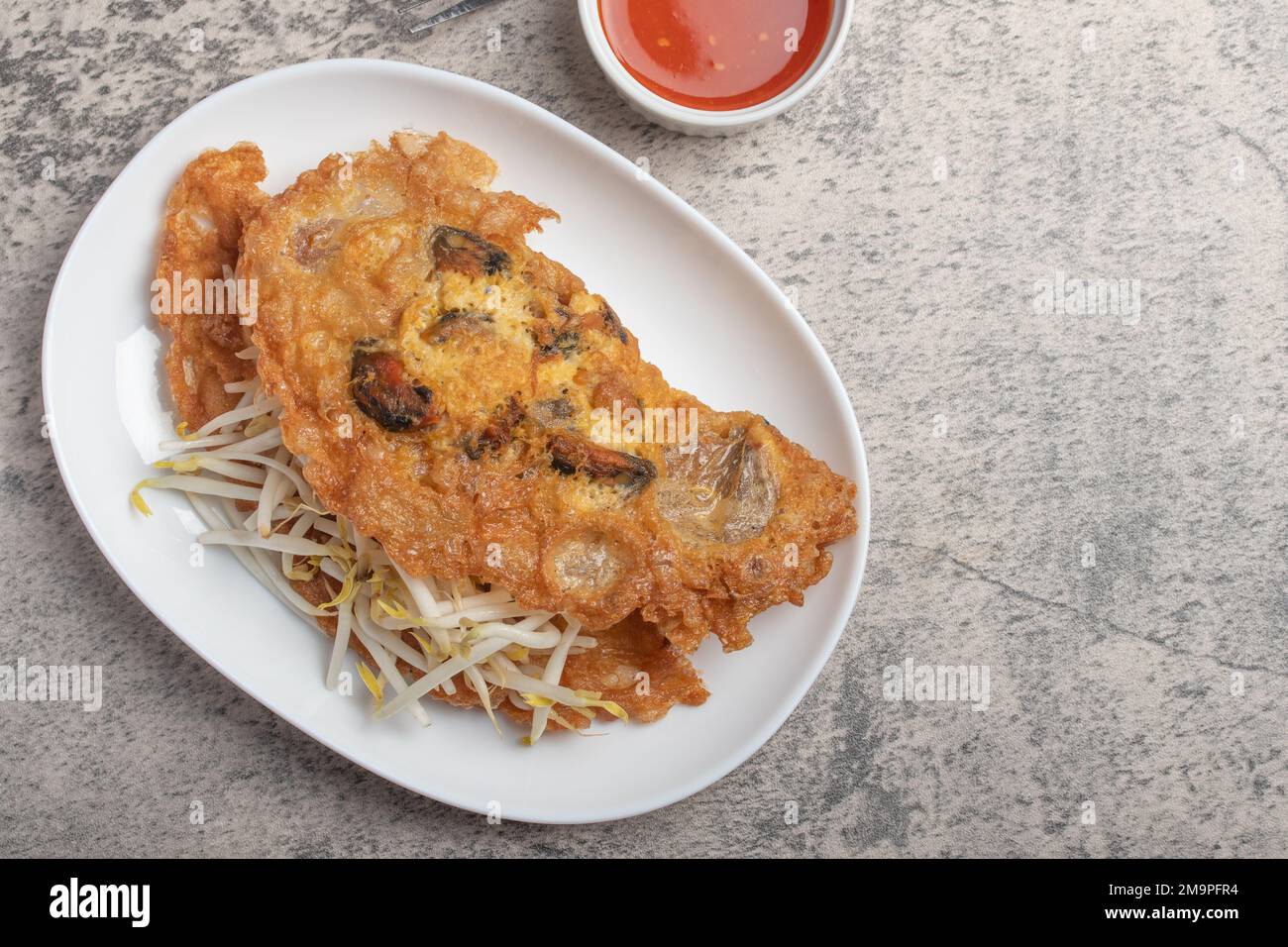 Fried mussels in crispy batter in a white plate Stock Photo - Alamy